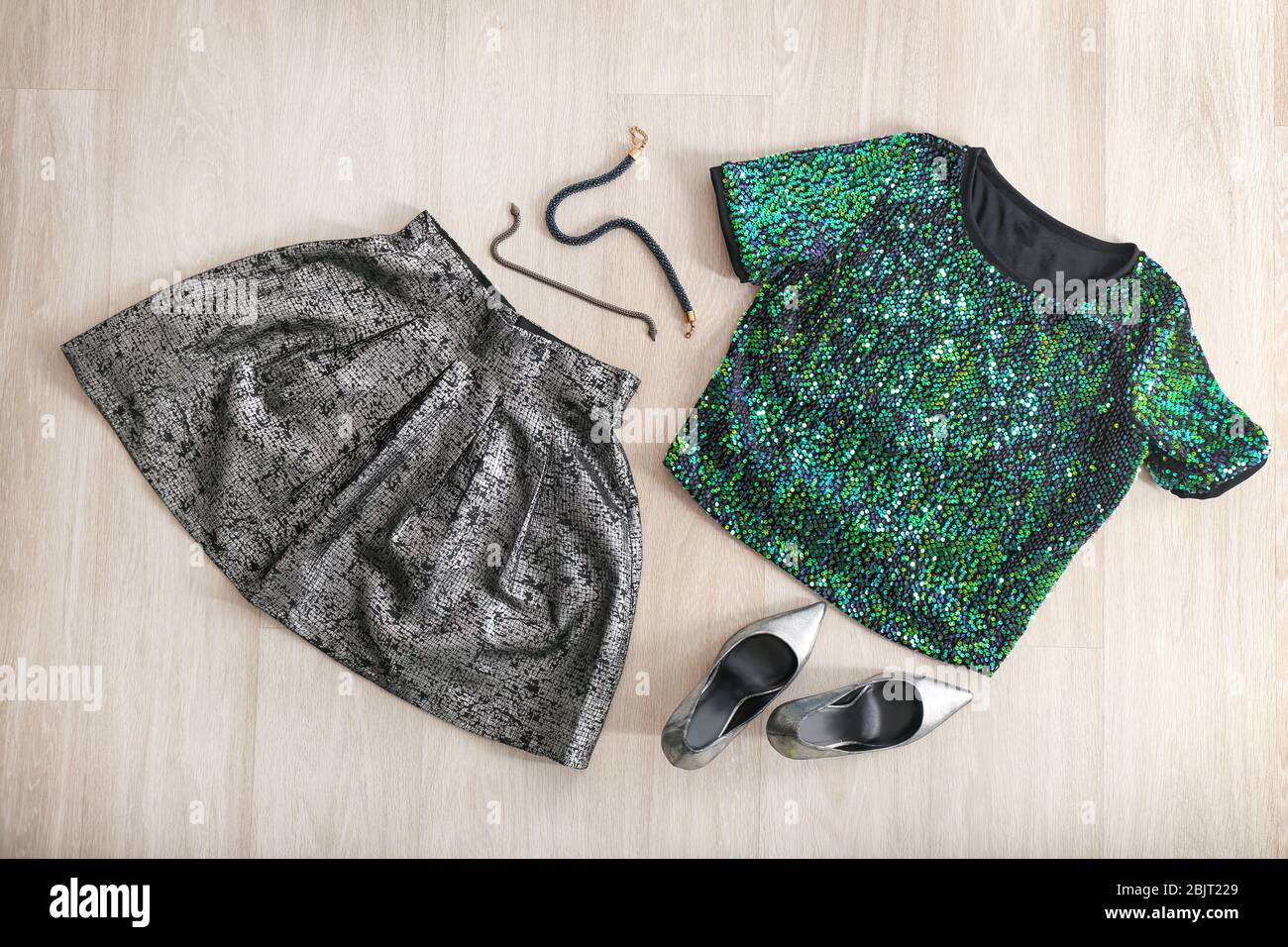 Set of stylish female clothes on light background, top view Stock Photo ...