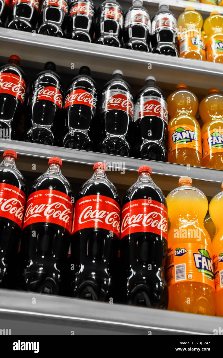 KYIV, UKRAINE - NOVEMBER 14, 2017: Stand with many bottles of Coca-Cola ...