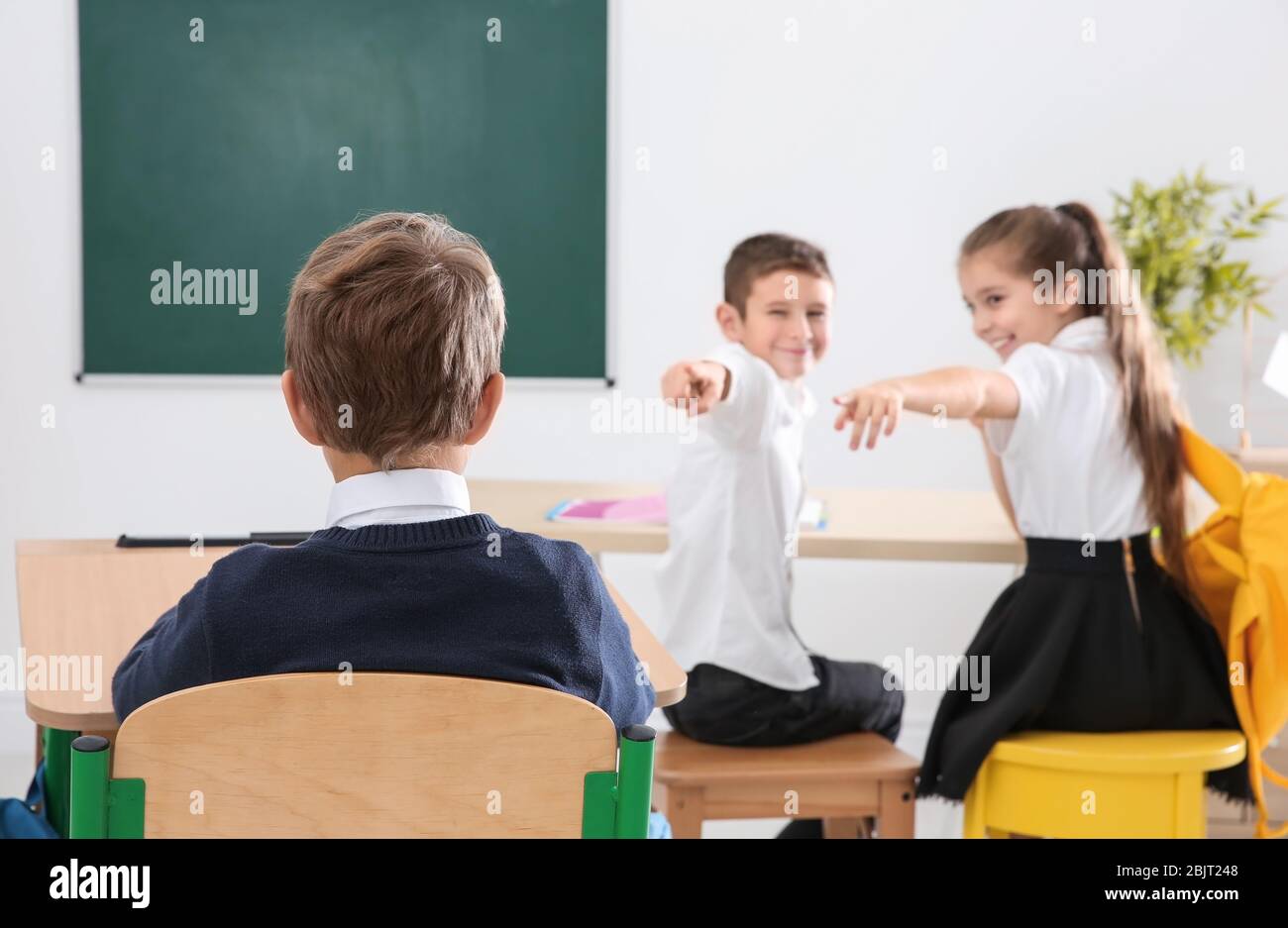 Children bullying their classmate in school Stock Photo - Alamy