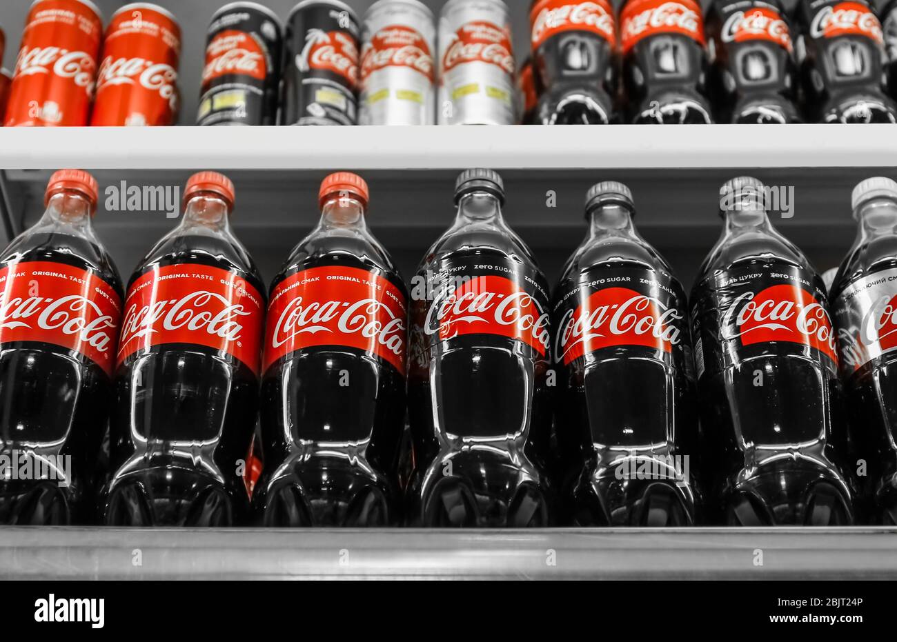 KYIV, UKRAINE - NOVEMBER 14, 2017: Stand with many bottles of Coca-Cola ...