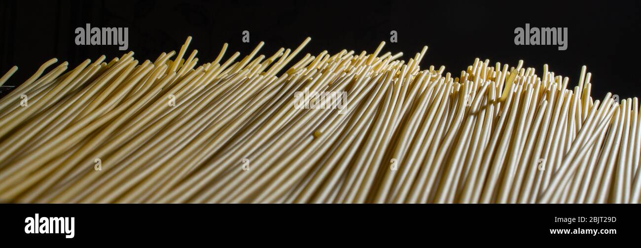 spaghetti pattern close up on black background Stock Photo - Alamy