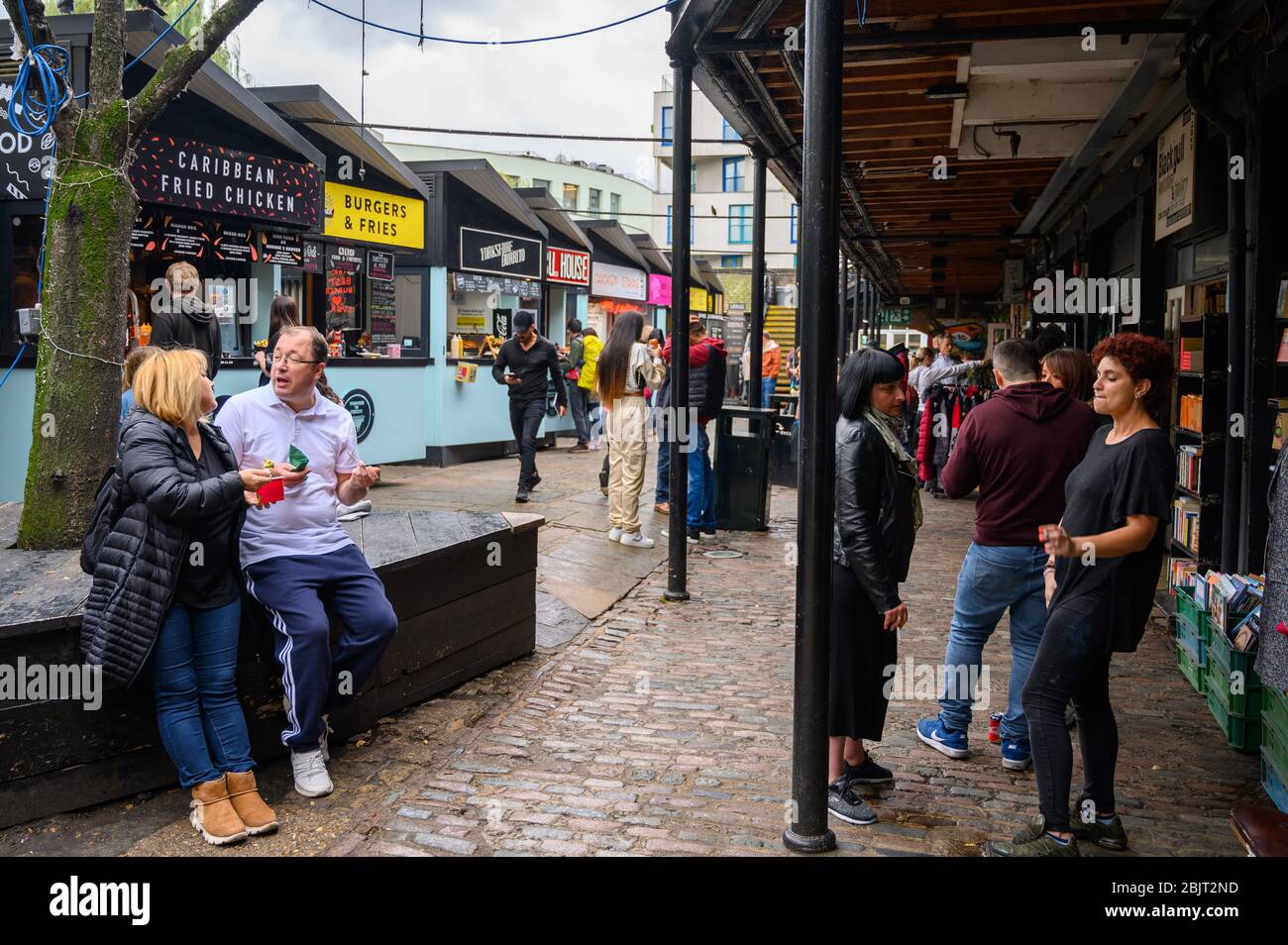LONDON - SEPTEMBER 30, 2019: Shoppers in an outdoor street food area of ...
