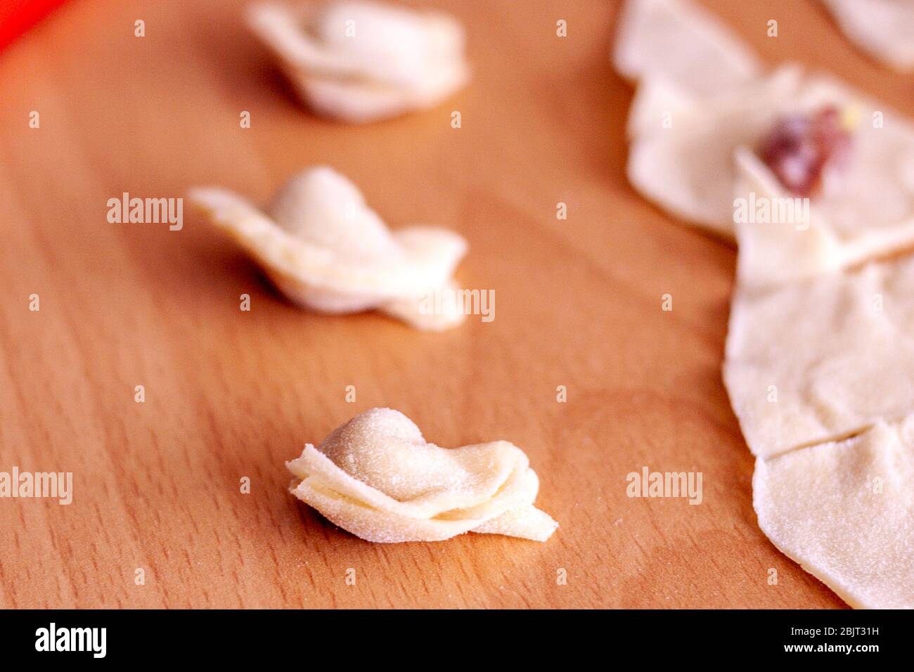 Uncooked homemade turkish manti (ravioli/ dumpling). Manti is a ...