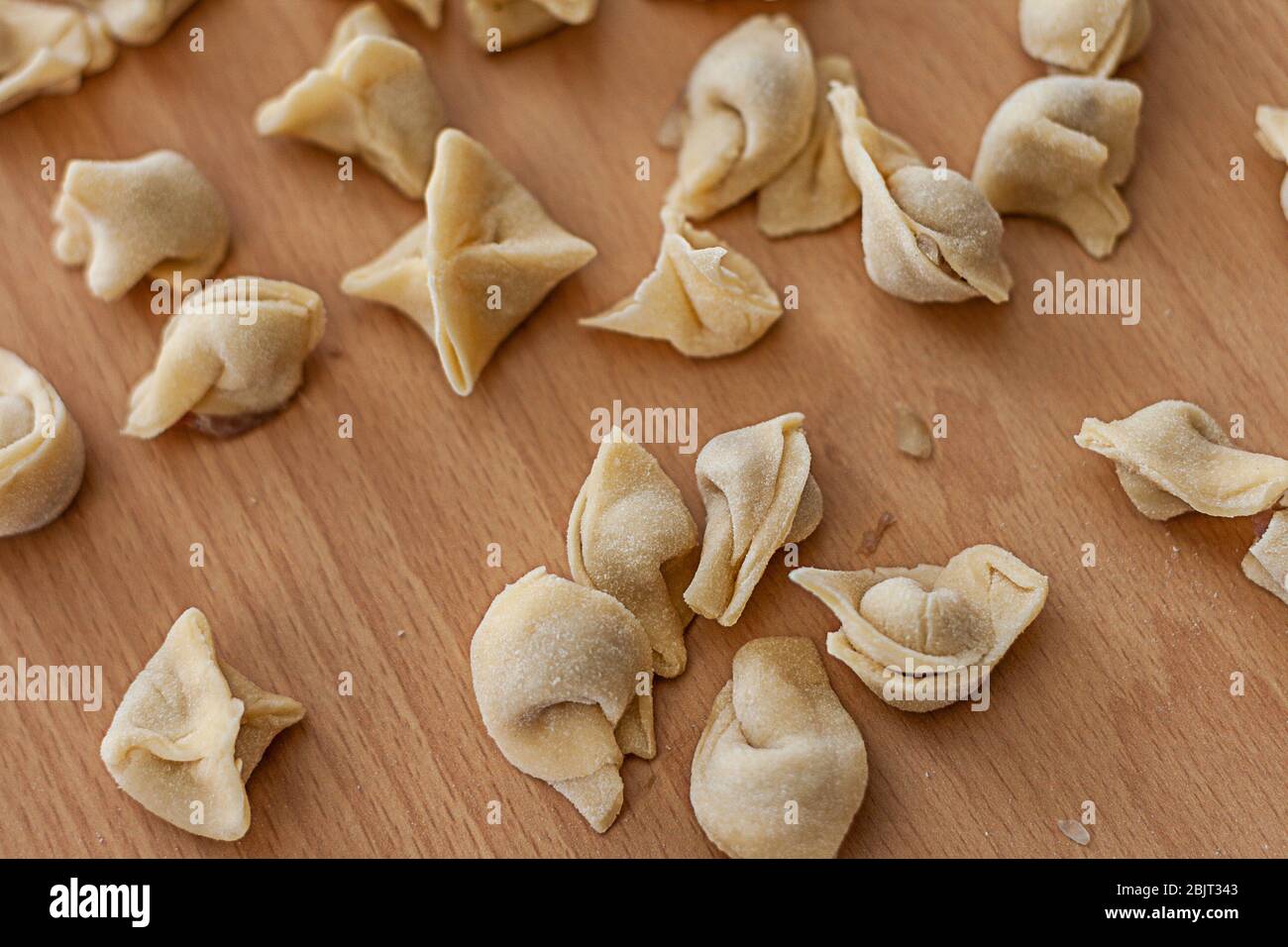 Uncooked homemade turkish manti (ravioli/ dumpling). Manti is a ...