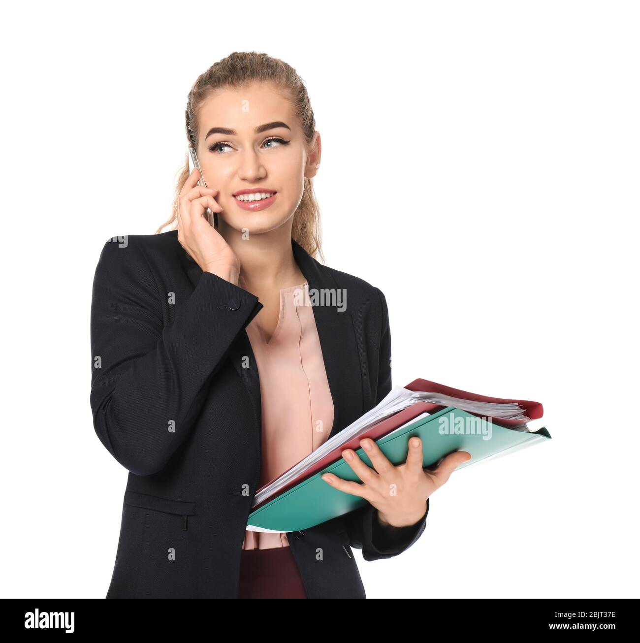 Beautiful real estate agent talking on phone against white background ...