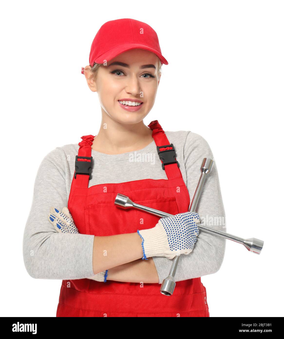 Female auto mechanic with lug wrench on white background Stock Photo ...