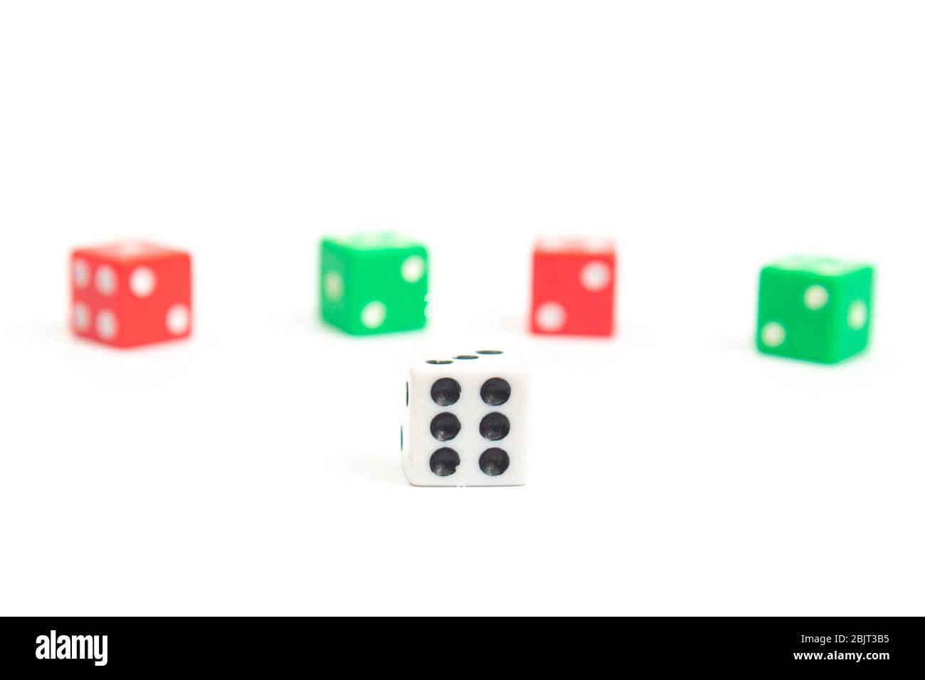 game dice of white red and green color on a white background isolate ...
