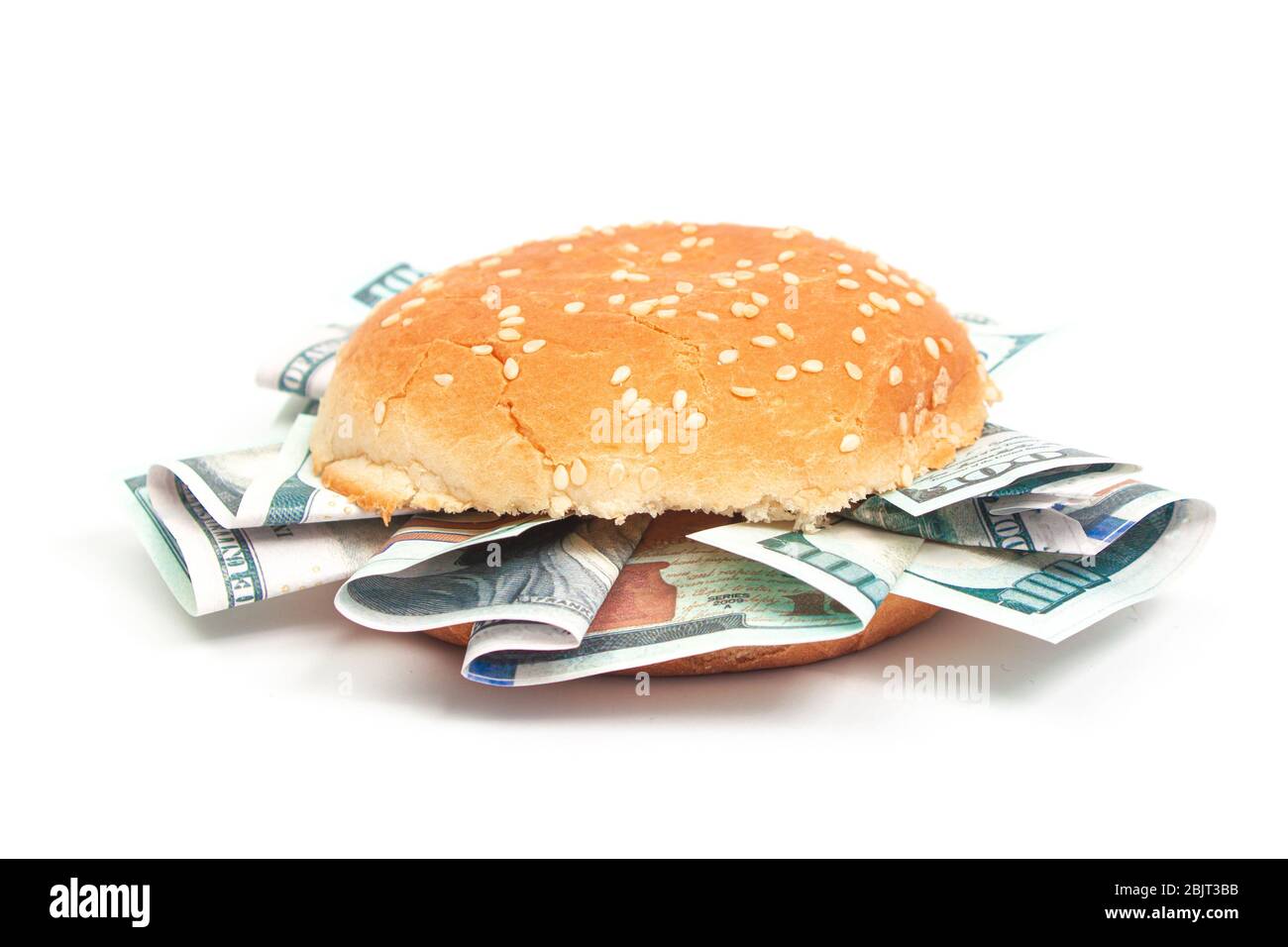 burger with hundred dollar bills instead of toppings on a white ...