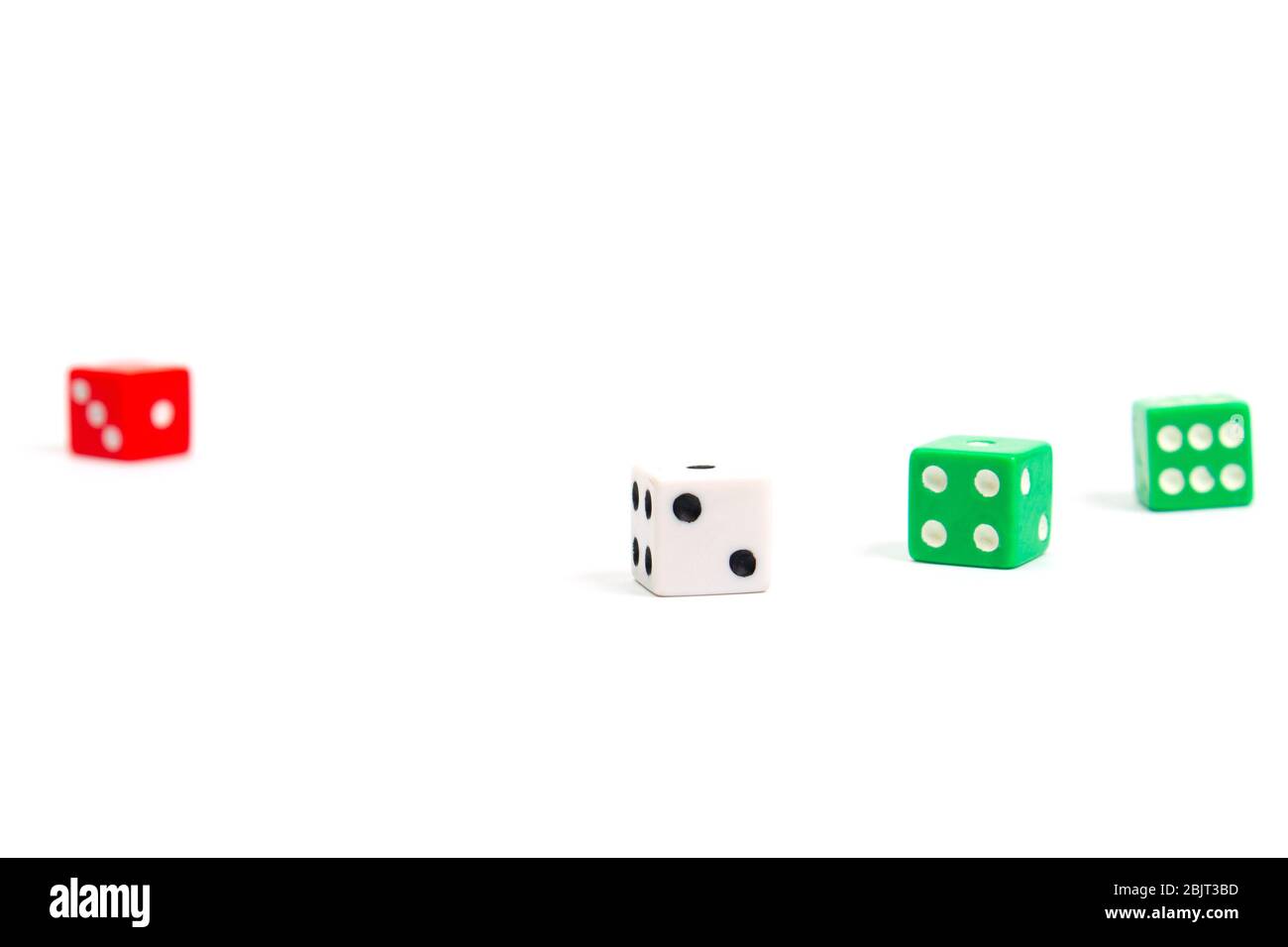 game dice scattered in white green and red on a white background ...