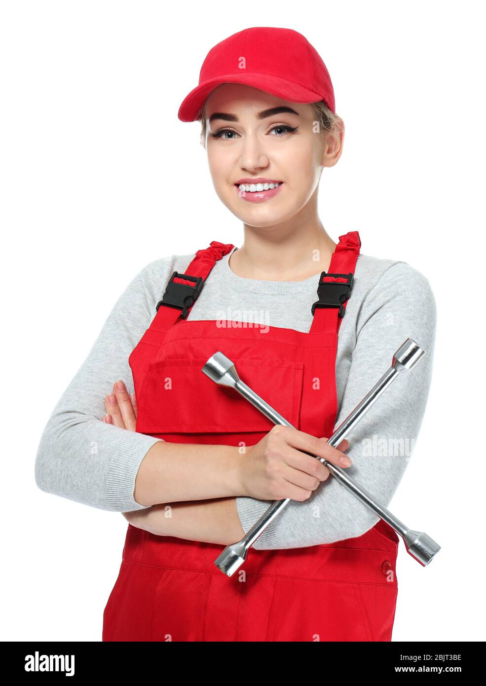 Female auto mechanic with lug wrench on white background Stock Photo ...