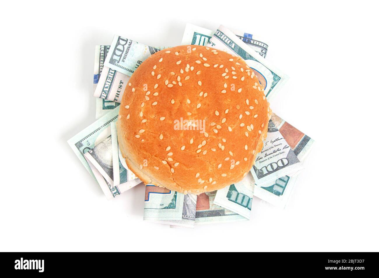 burger with hundred dollar bills instead of toppings on a white ...