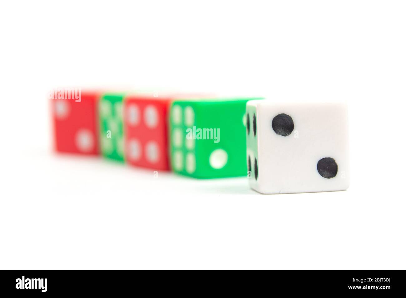 game dice of white red and green color on a white background isolate ...