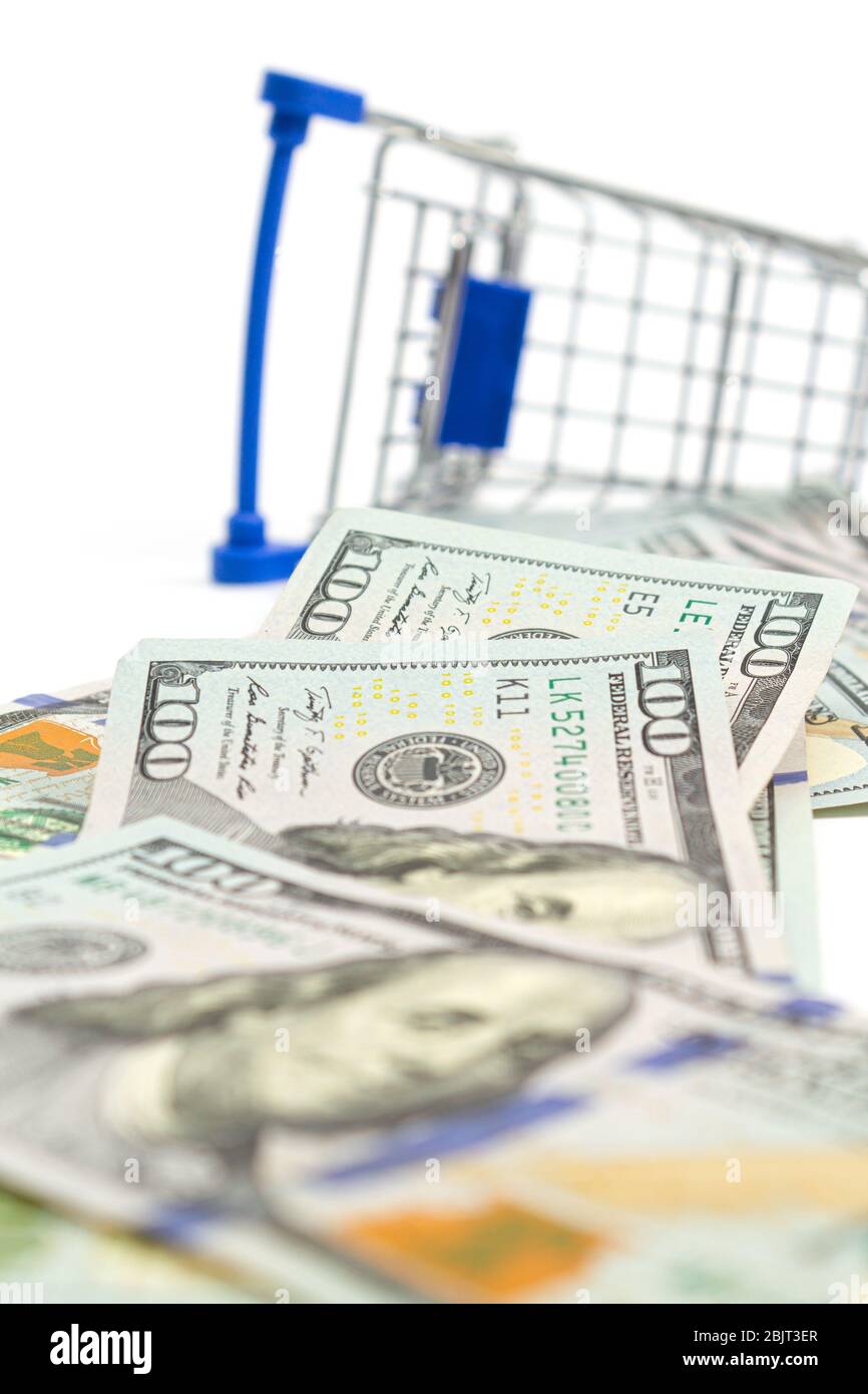 fallen basket with blue inserts drop hundred dollar bills on a white ...