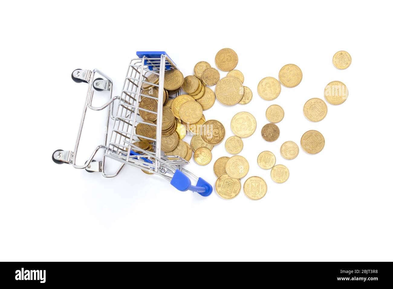 fallen shopping cart with coins fallen on a white background. isolate ...