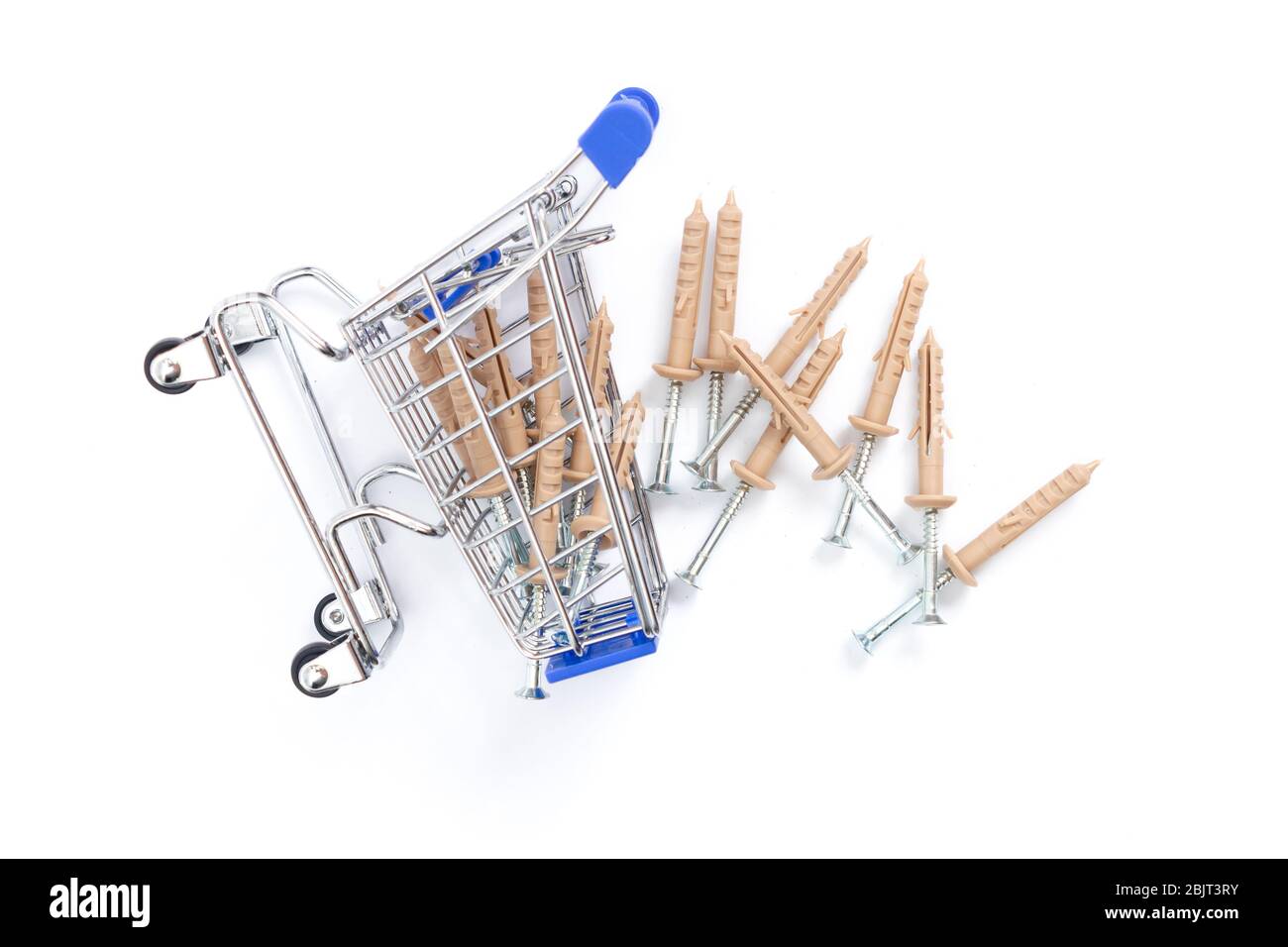 fallen shopping cart with screws for the wall on a white background ...