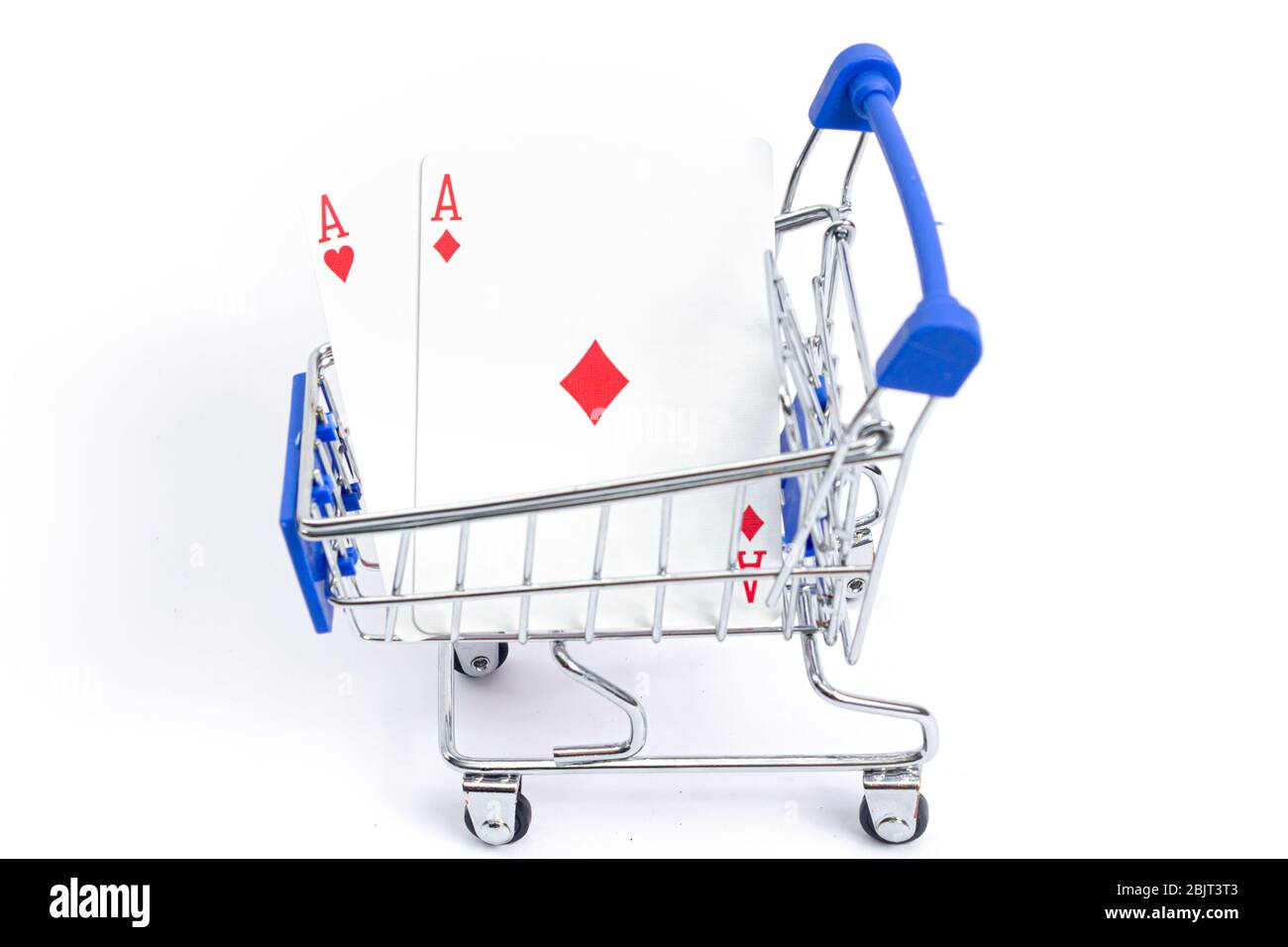 shopping cart with playing cards two red aces diamond and heart on a ...