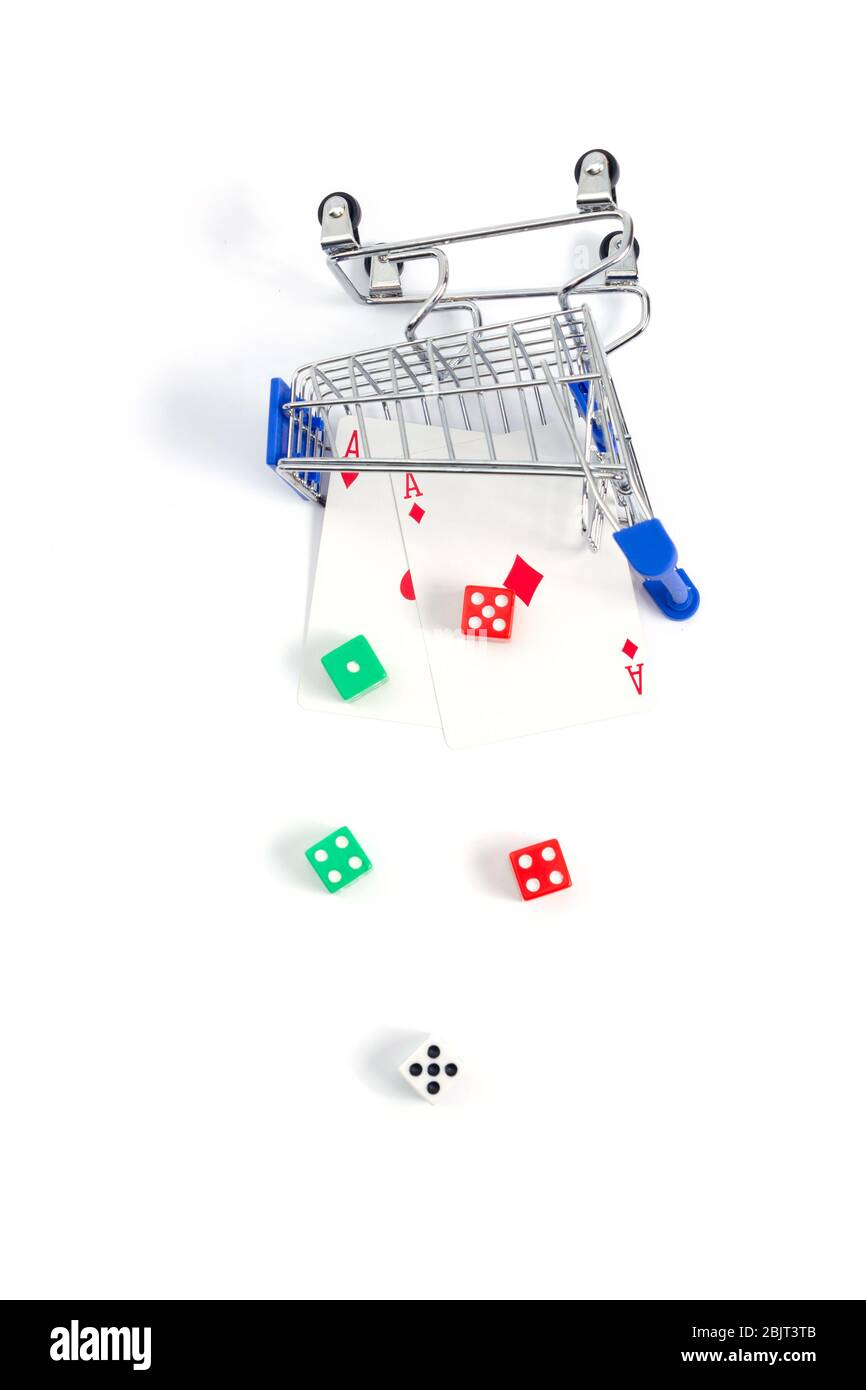 fallen shopping cart with playing cards two red aces diamond, heart and ...