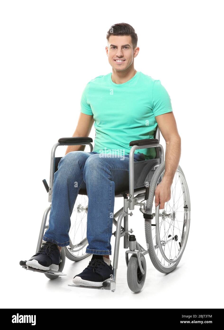 Young man in wheelchair on white background Stock Photo - Alamy