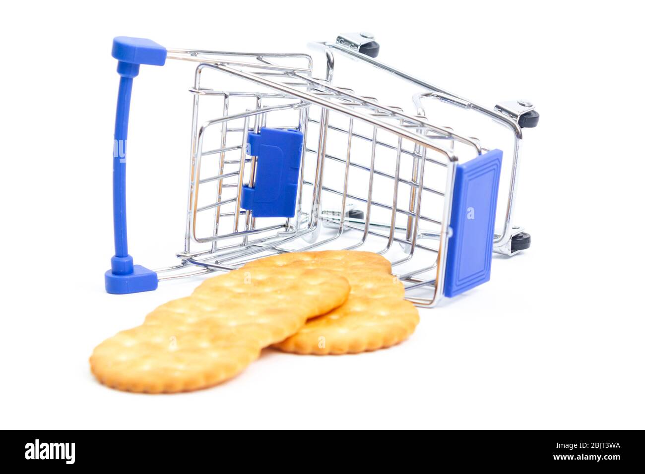 fallen shopping cart with crackers on a white background. isolate Stock ...