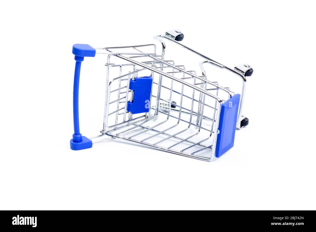 fallen shopping cart on a white background. isolate Stock Photo - Alamy