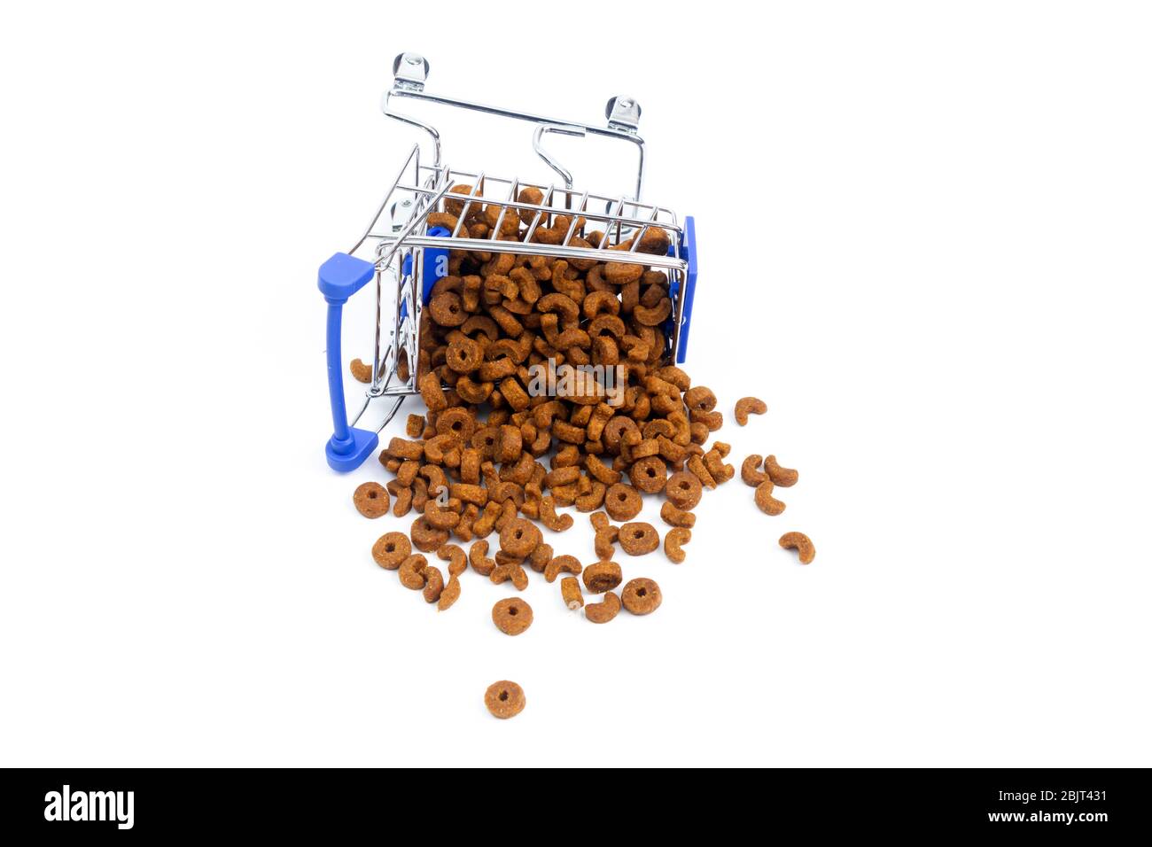 fallen shopping cart with food for animals, dogs, cats on a white ...