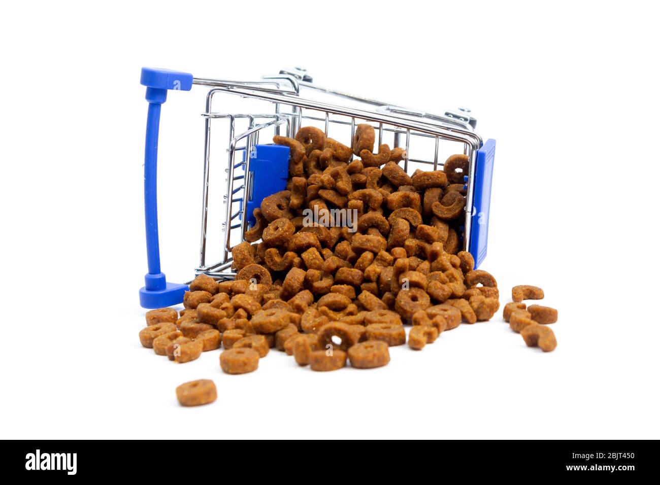 fallen shopping cart with food for animals, dogs, cats on a white ...