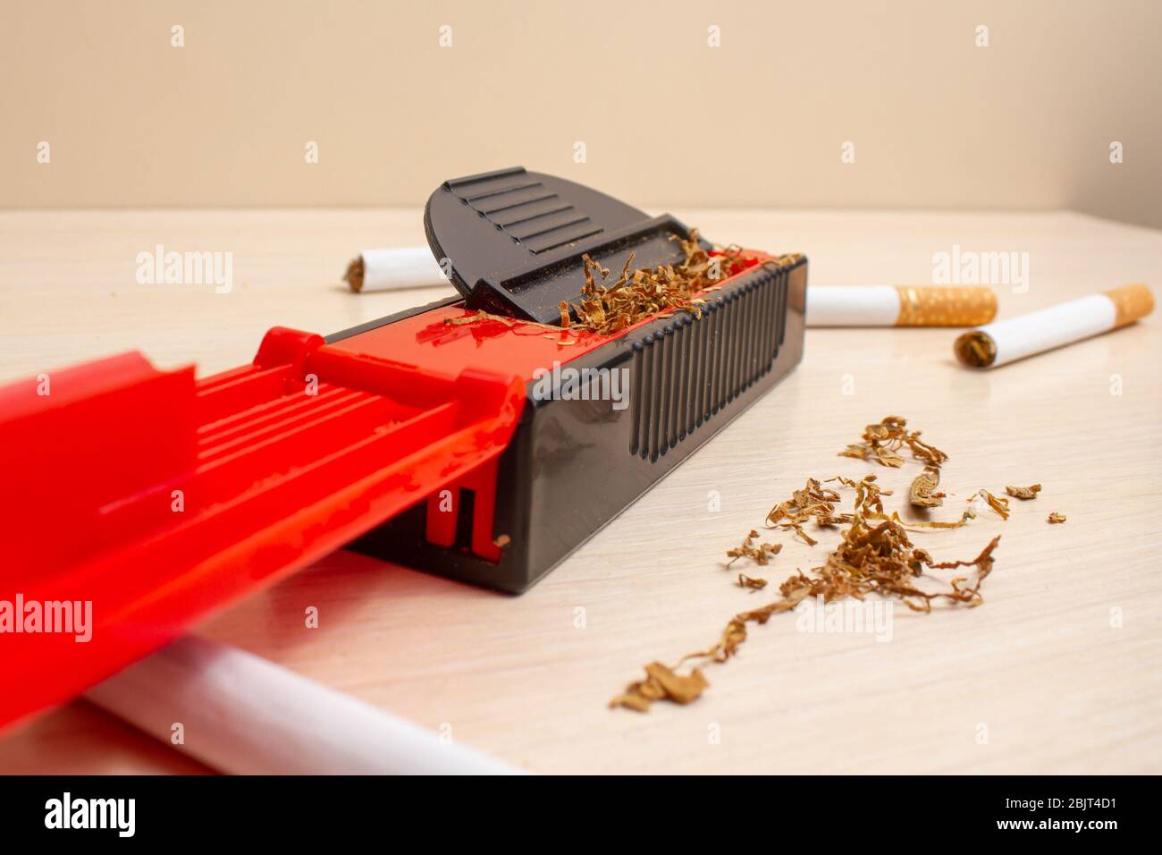 typing machine and cigarettes in the background on a light wooden Stock ...