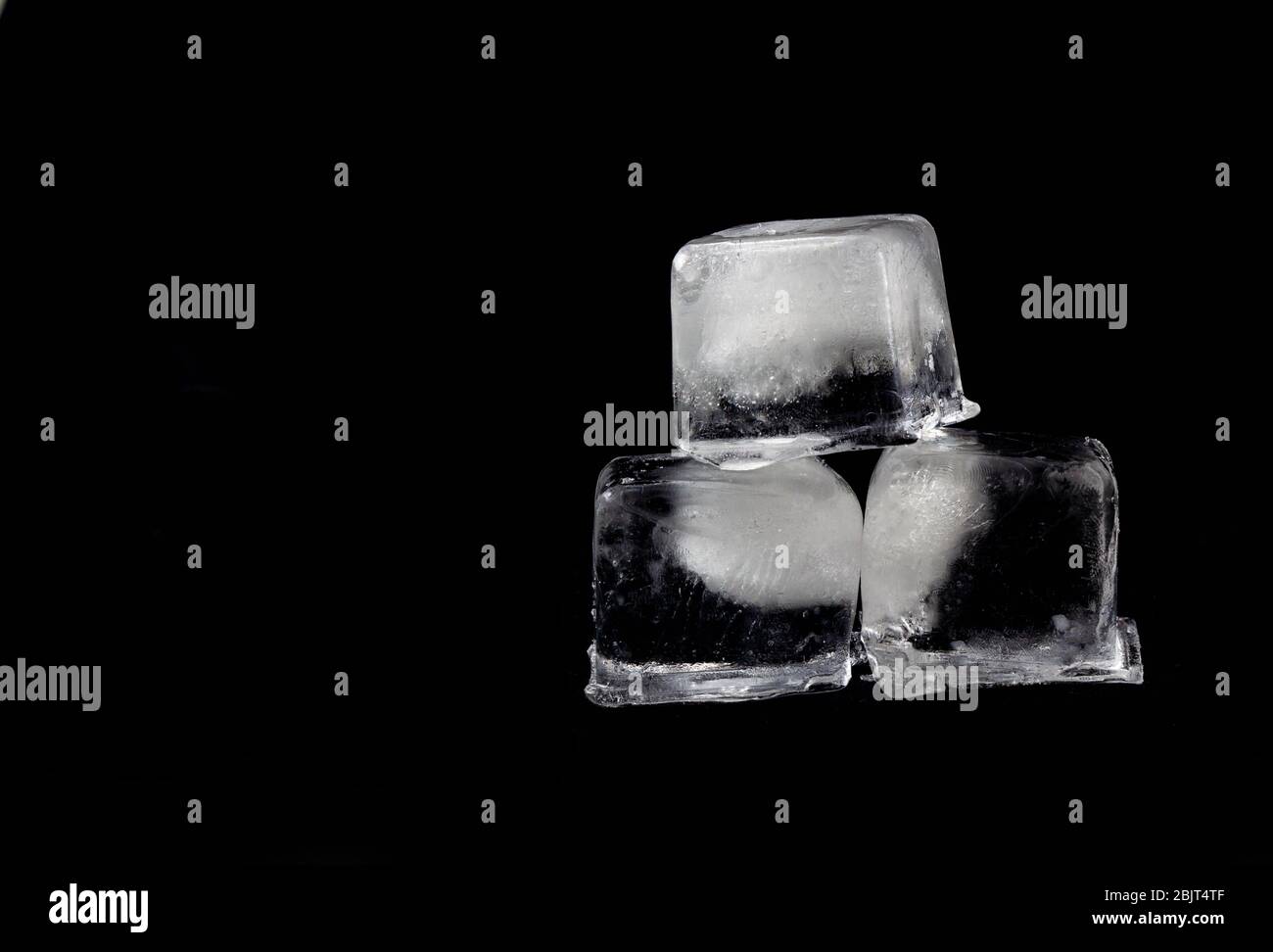 Three pieces of ice on a black background 3 Stock Photo - Alamy