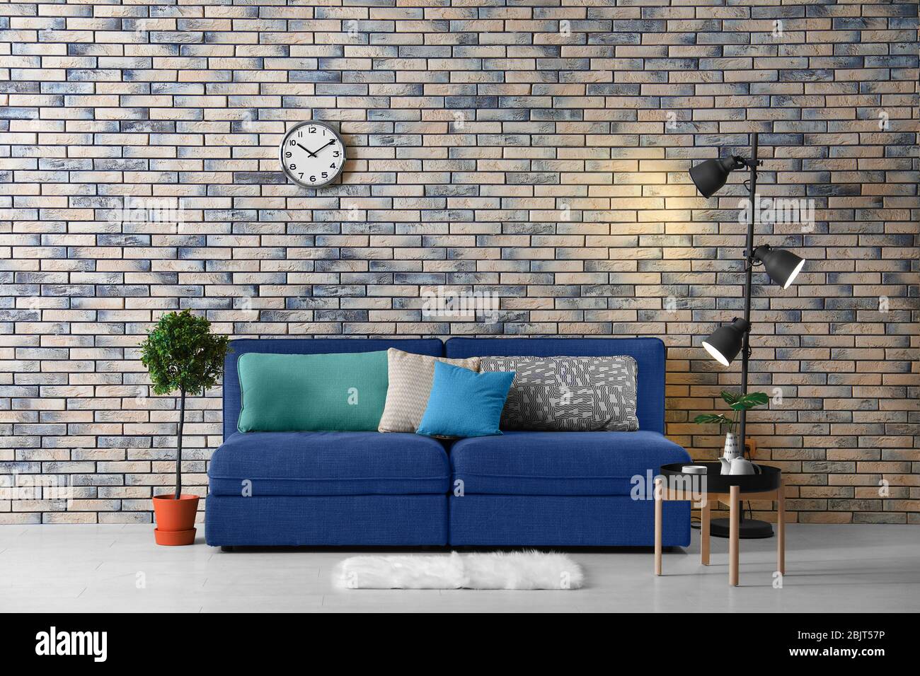 Modern living room interior with comfortable couch Stock Photo - Alamy