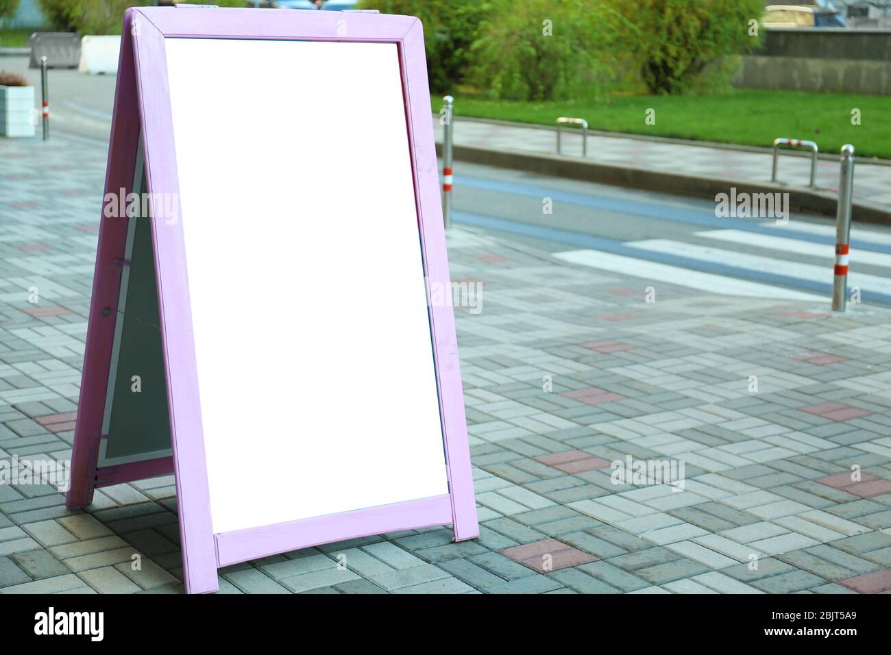 Advertising sidewalk board outdoors Stock Photo - Alamy