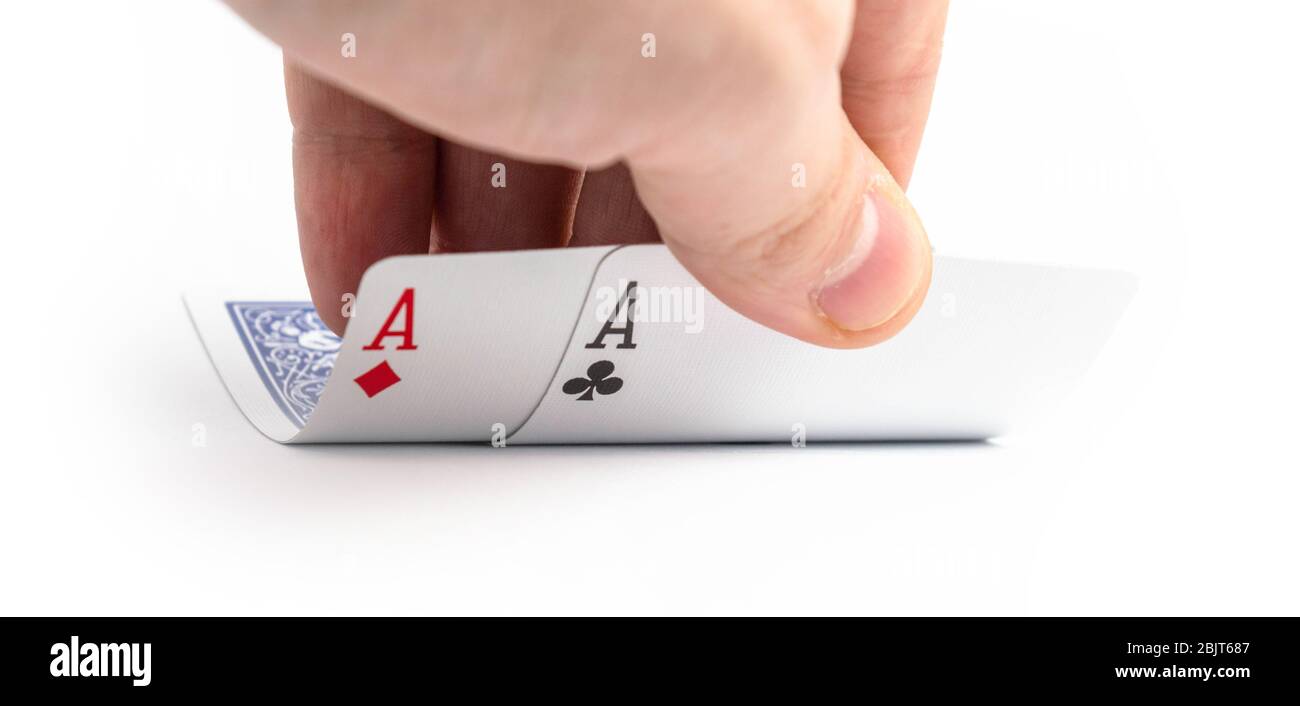 Hand raises two aces, pocket pair on a white background isolate Stock ...