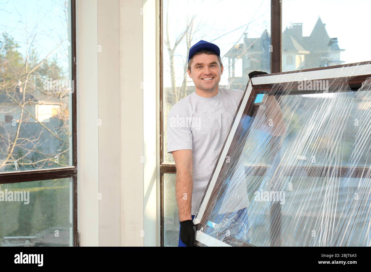 Man carrying glass window hi-res stock photography and images - Alamy