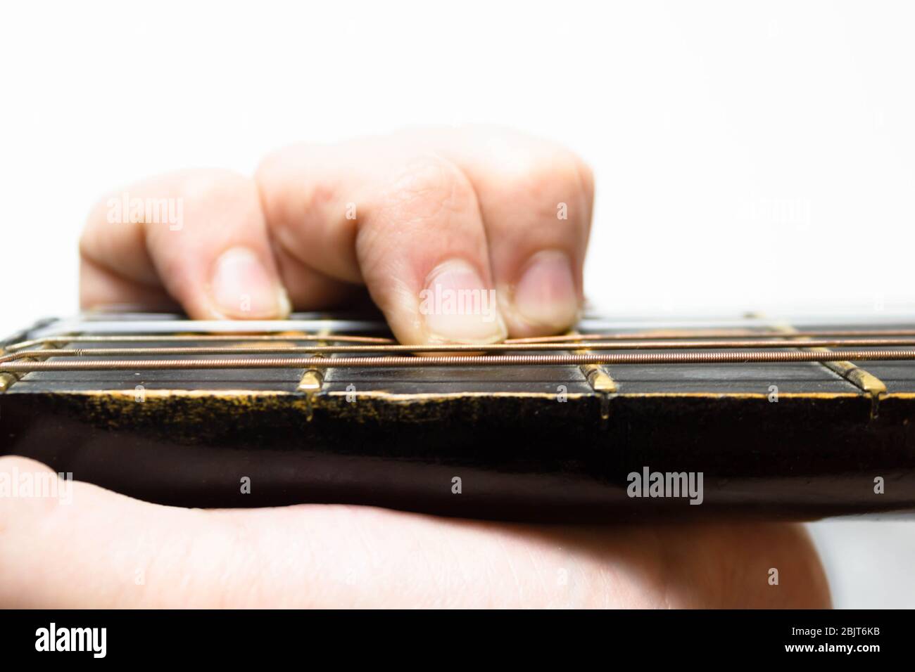 finger chords acoustic guitar on white background Stock Photo - Alamy