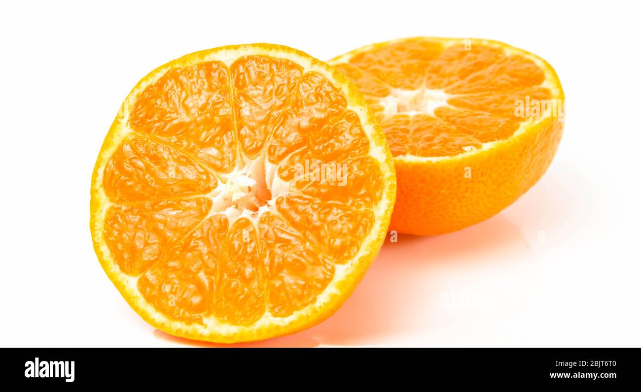 Half tangerine orange cut in half on a white background Stock Photo - Alamy