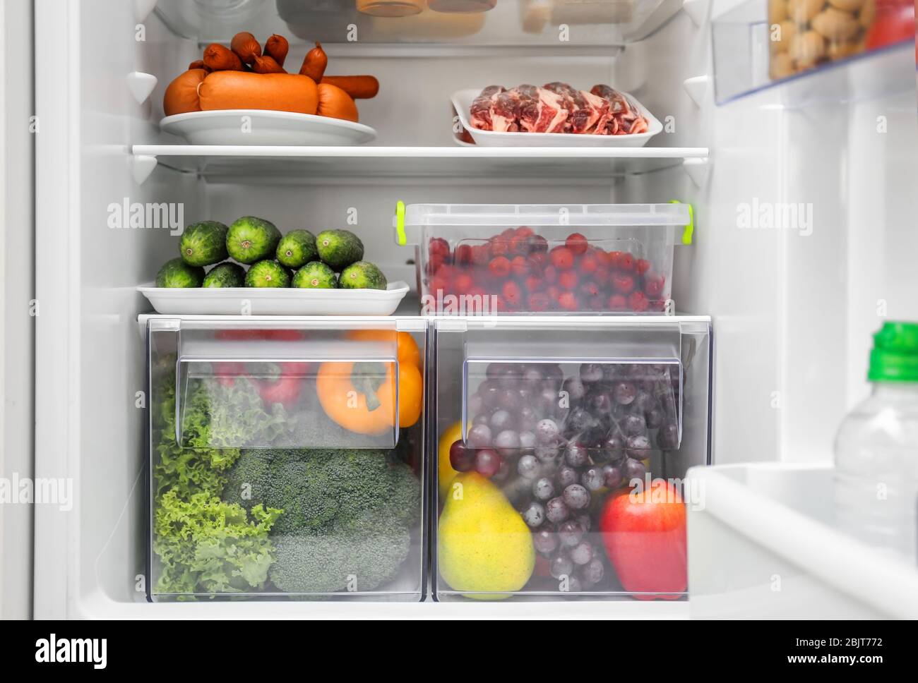 Different products on refrigerator shelves Stock Photo - Alamy