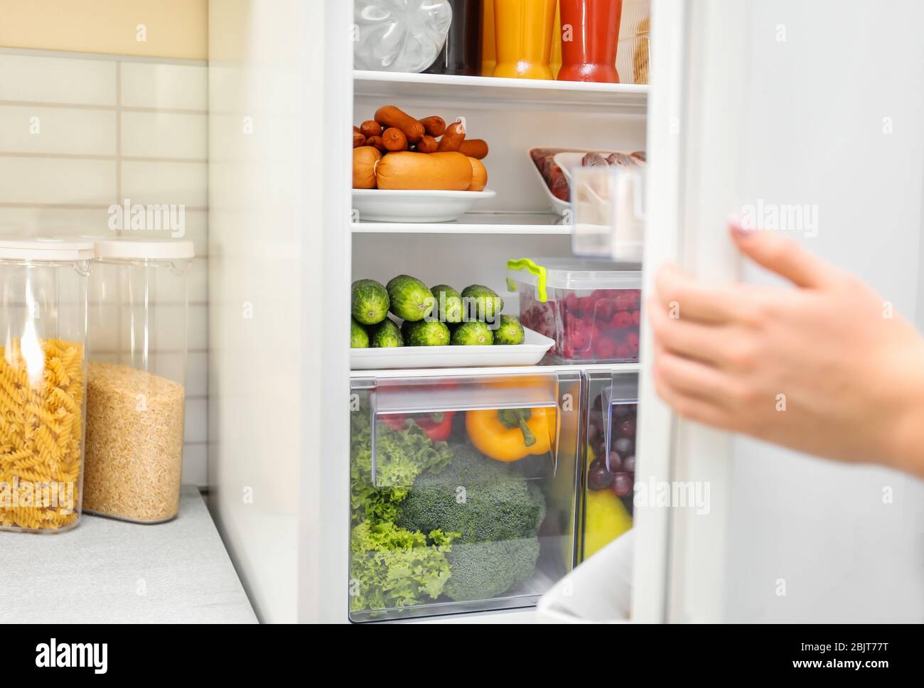 Woman opening refrigerator hi-res stock photography and images - Alamy