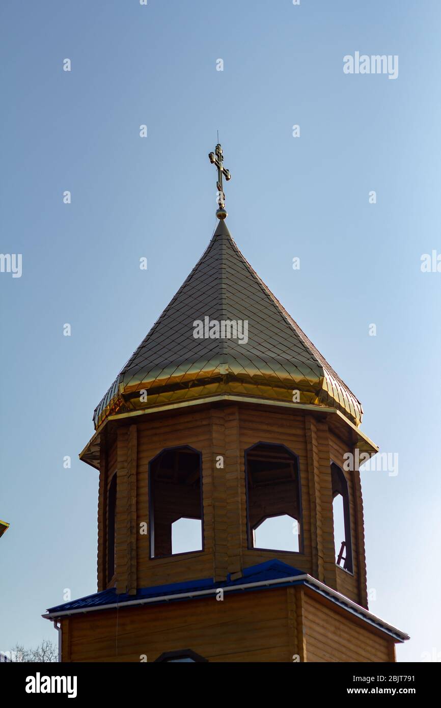 Golden domes of a wooden church Stock Photo - Alamy