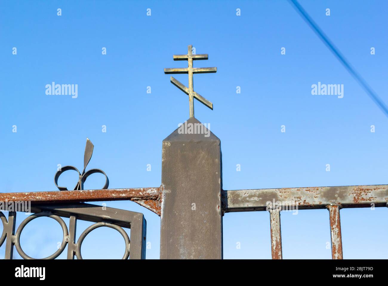 Christian metal forged fence with crosses Stock Photo - Alamy