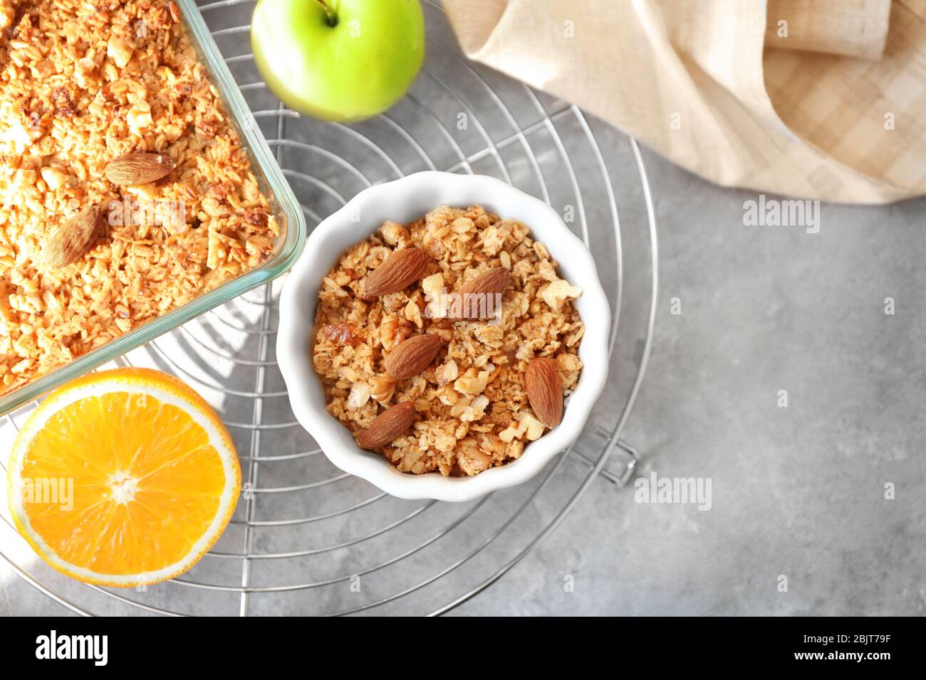 Ramekin with apple crisp and fruits on cooling rack, top view Stock ...