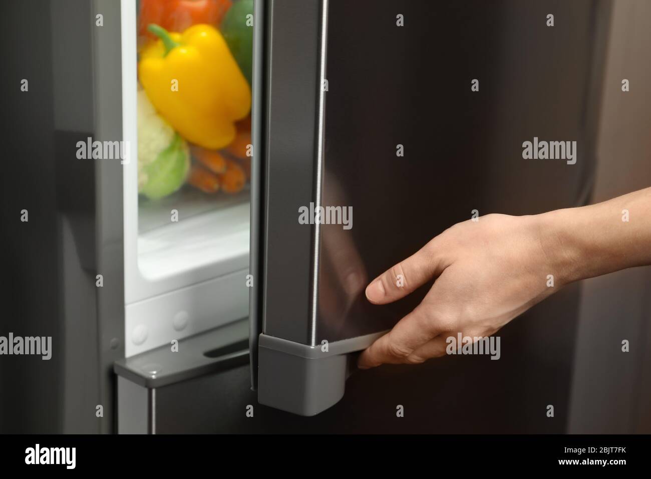 Woman opening refrigerator hi-res stock photography and images - Alamy