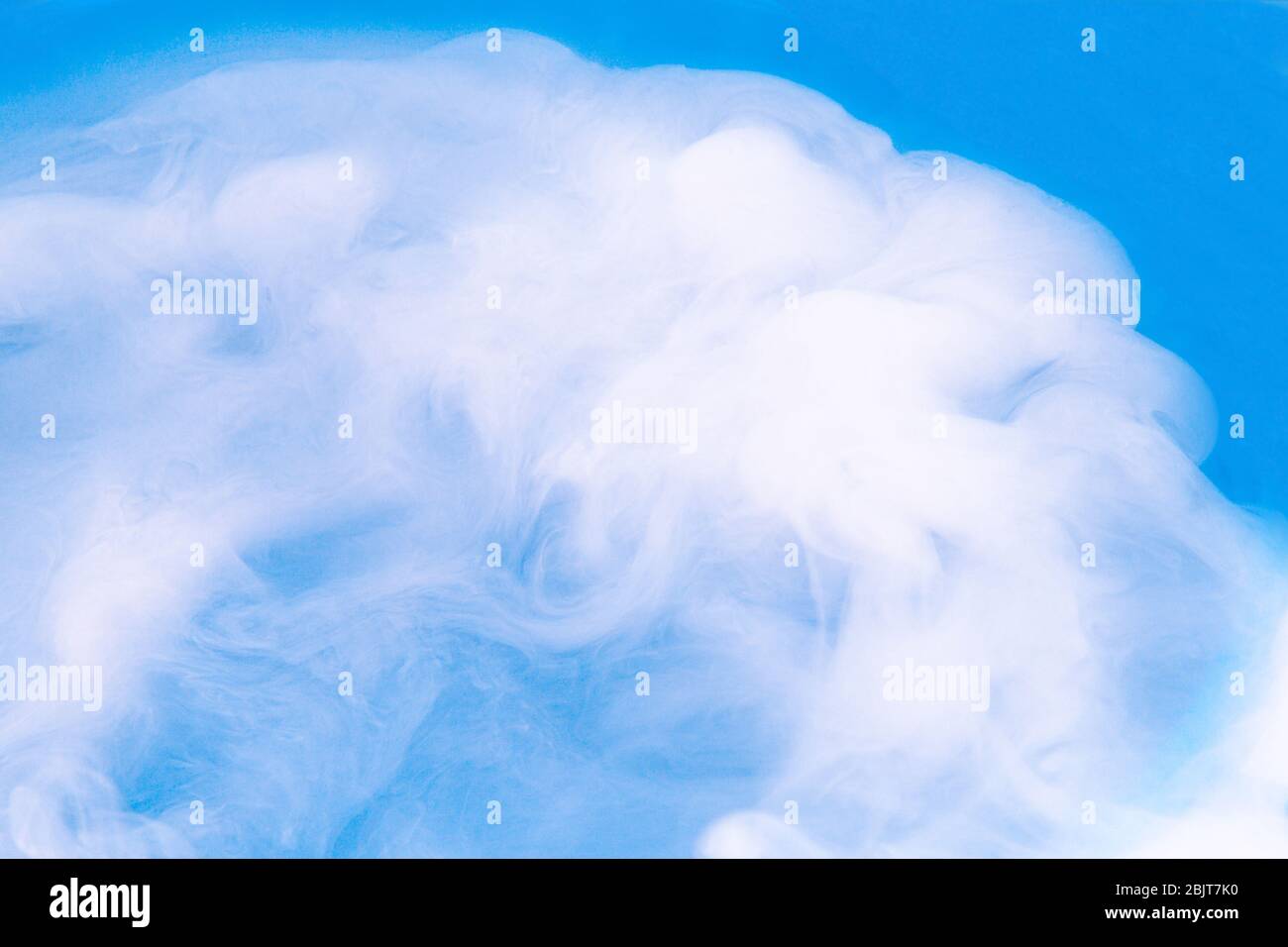 smoke spreads through blue water Stock Photo - Alamy