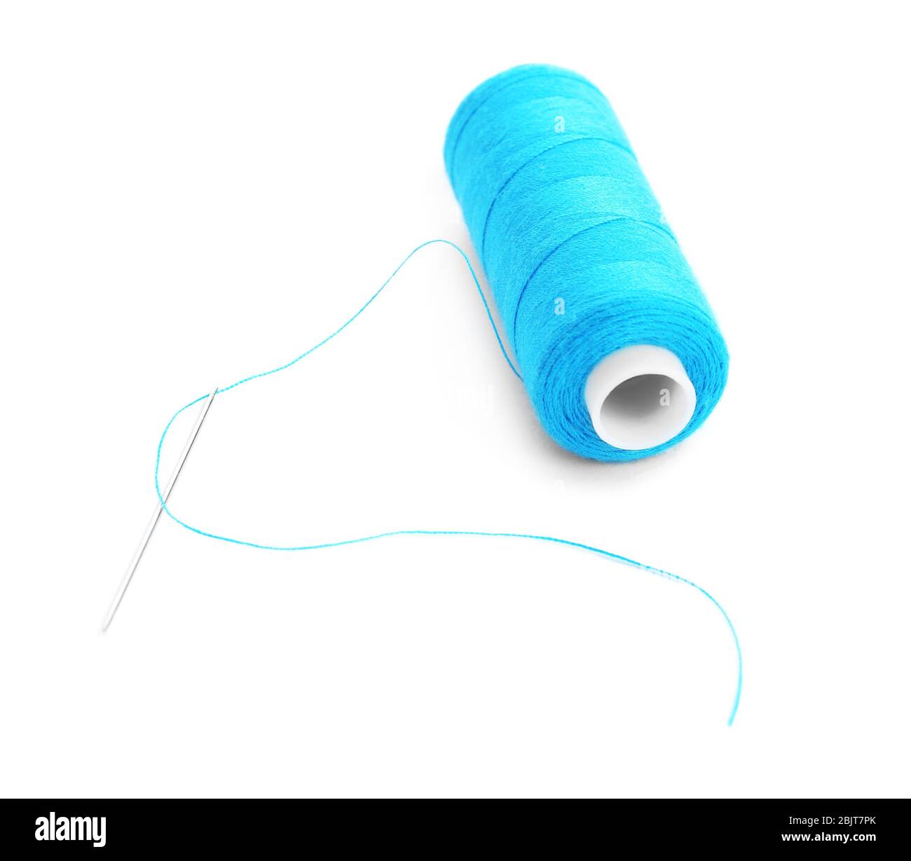 Blue thread and needle on white background Stock Photo - Alamy
