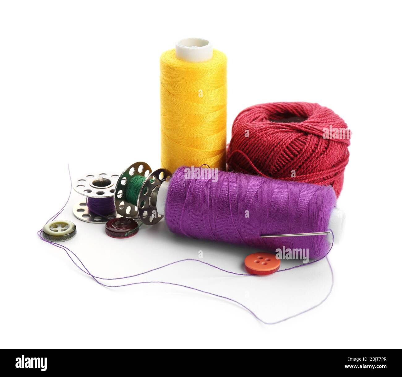 Colorful threads and sewing accessories on white background Stock Photo ...