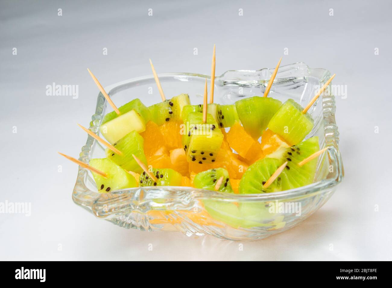 useful fruit canapes from orange banana and kiwi in a glass of fitness ...
