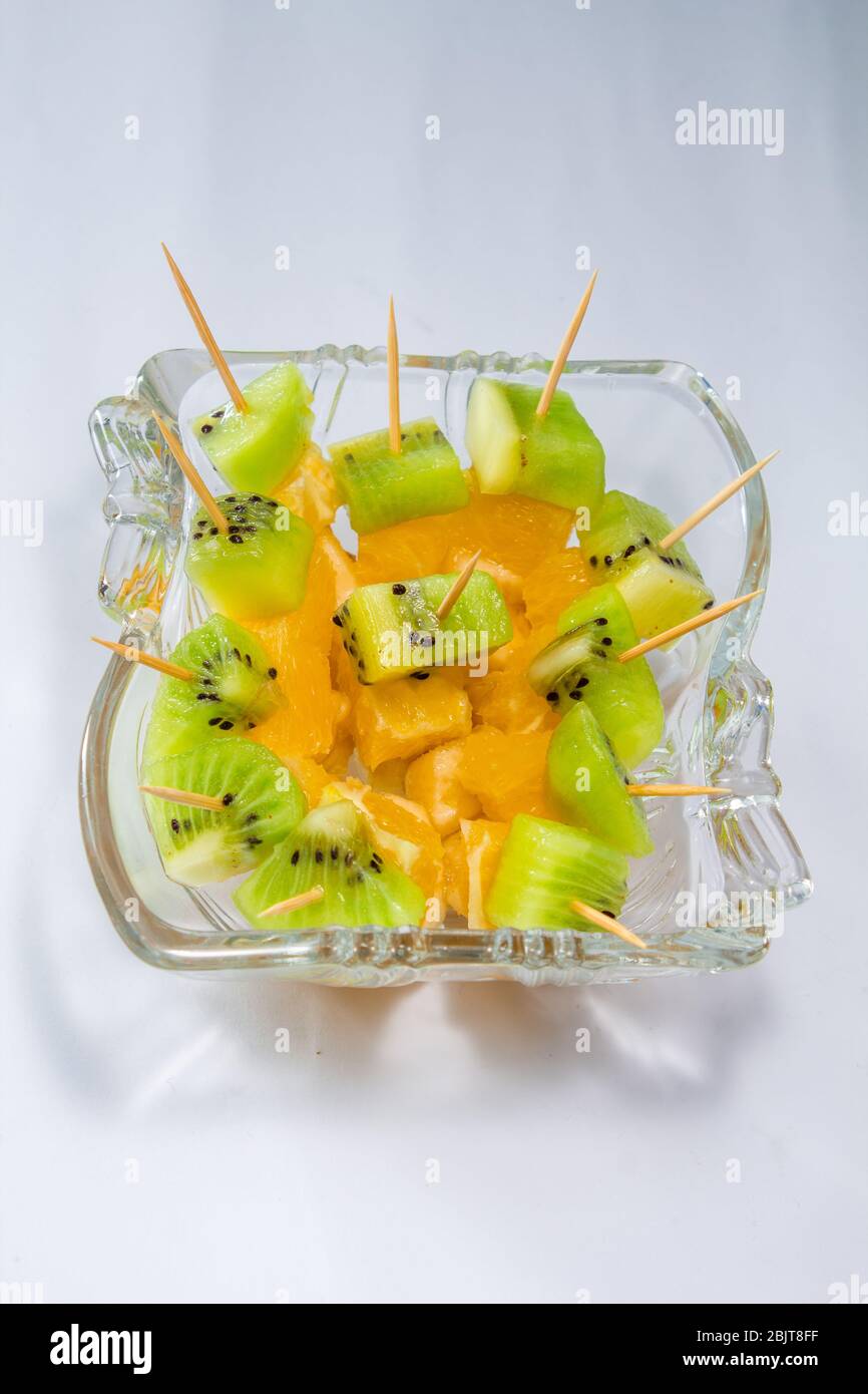 useful fruit canapes from orange banana and kiwi in a glass of fitness ...