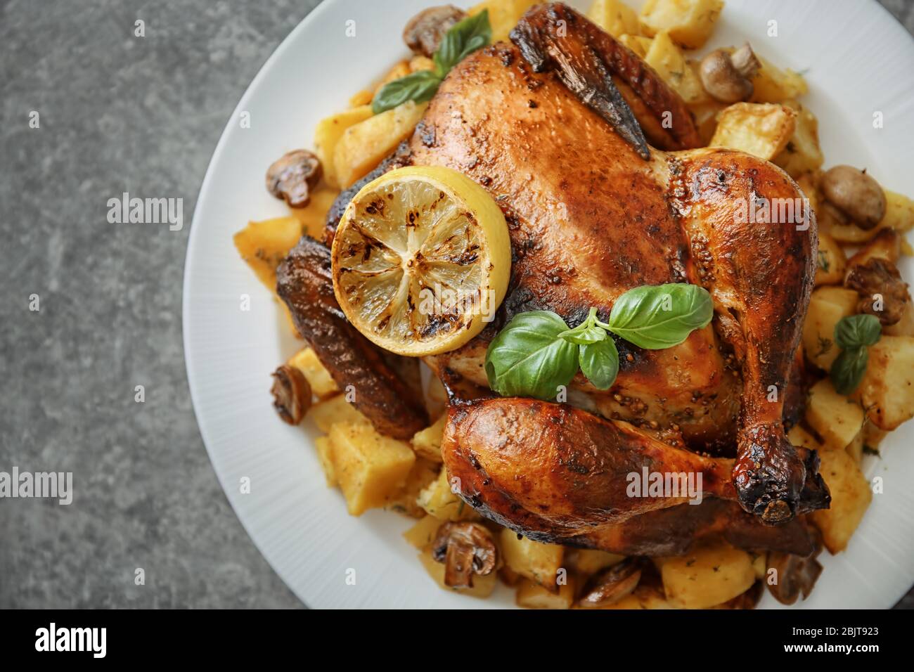 Grilled whole chicken side view hi-res stock photography and images - Alamy