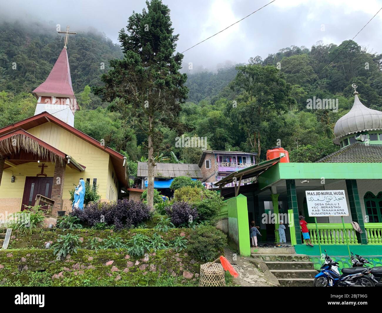 A Church and a Mosque close together Stock Photo - Alamy