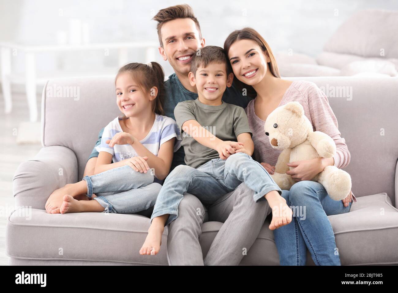 Happy family with little children at home Stock Photo - Alamy
