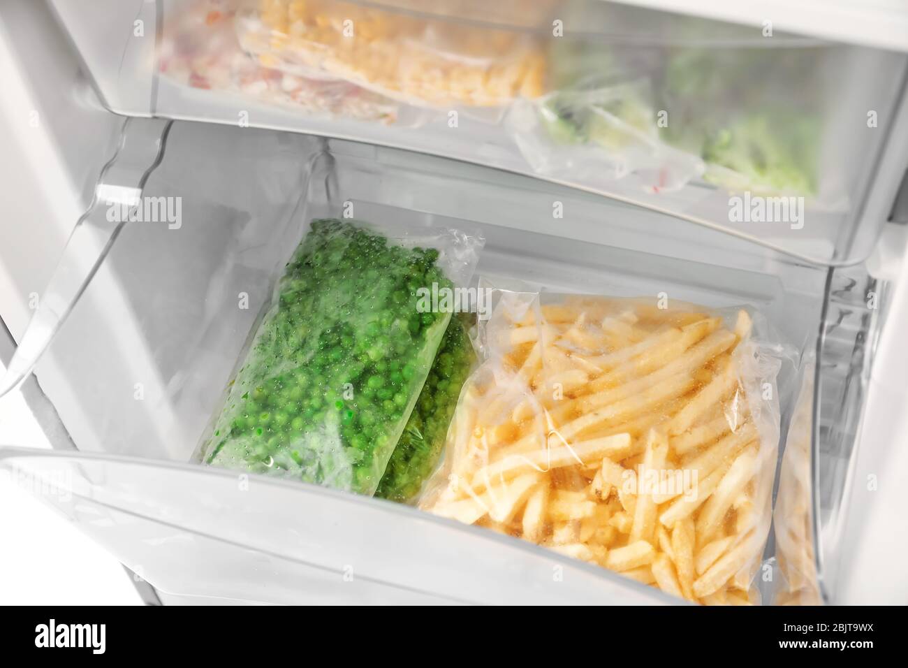 Frozen vegetables in refrigerator, closeup Stock Photo - Alamy