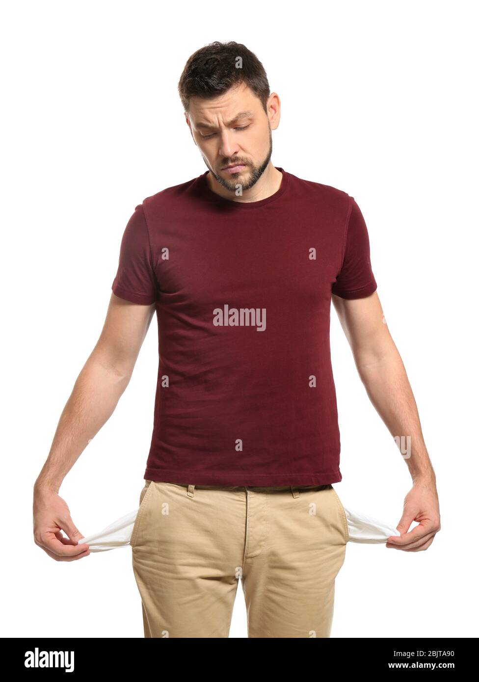 Man showing empty pockets on white background Stock Photo - Alamy